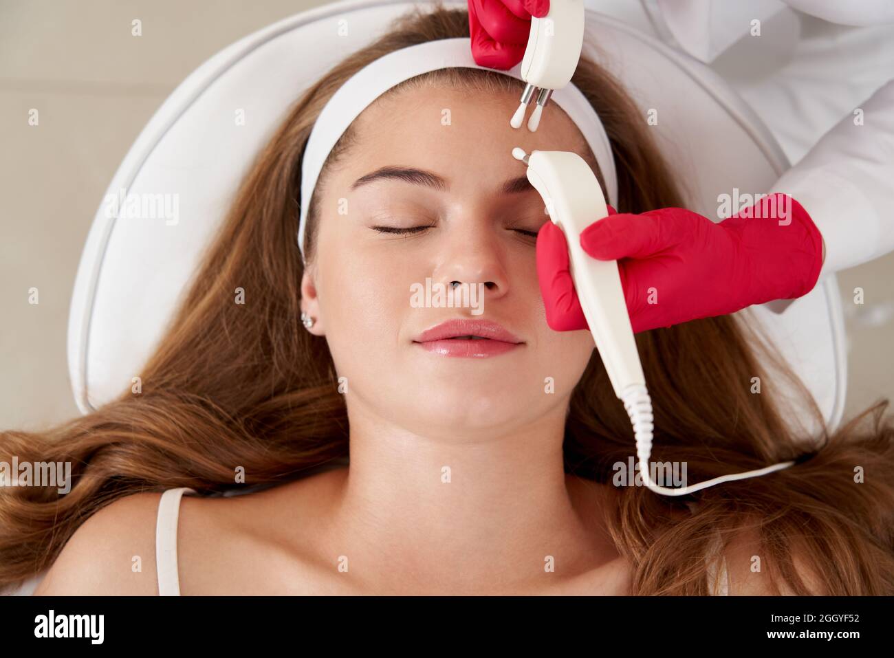 Beautiful Woman in Spa Clinic Receiving Stimulating Electric Facial ...