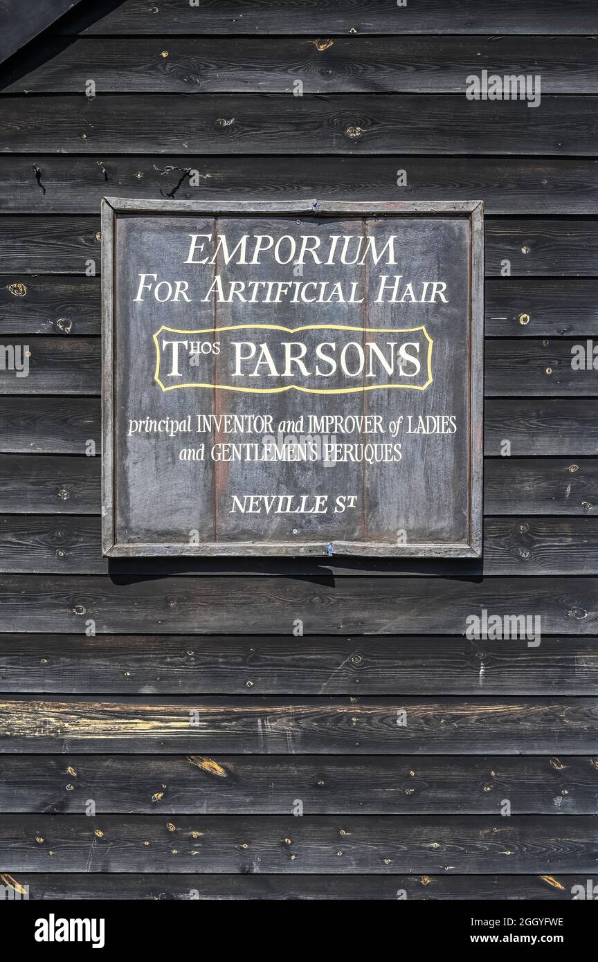 This is one of several quayside advertisement signs at the Victorian ...