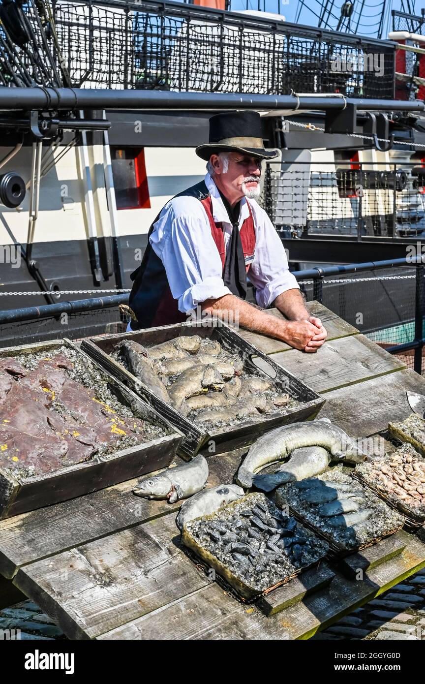 This scene is of a Victorian era Fish-monger at the quayside by the ...