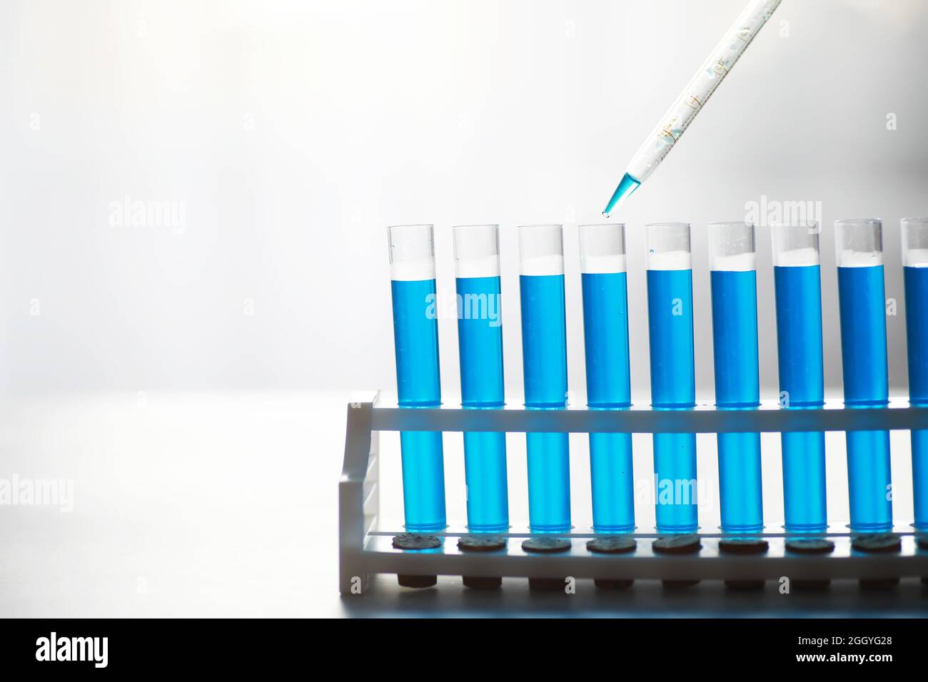 Test tube of glass overflows new liquid solution potassium blue ...