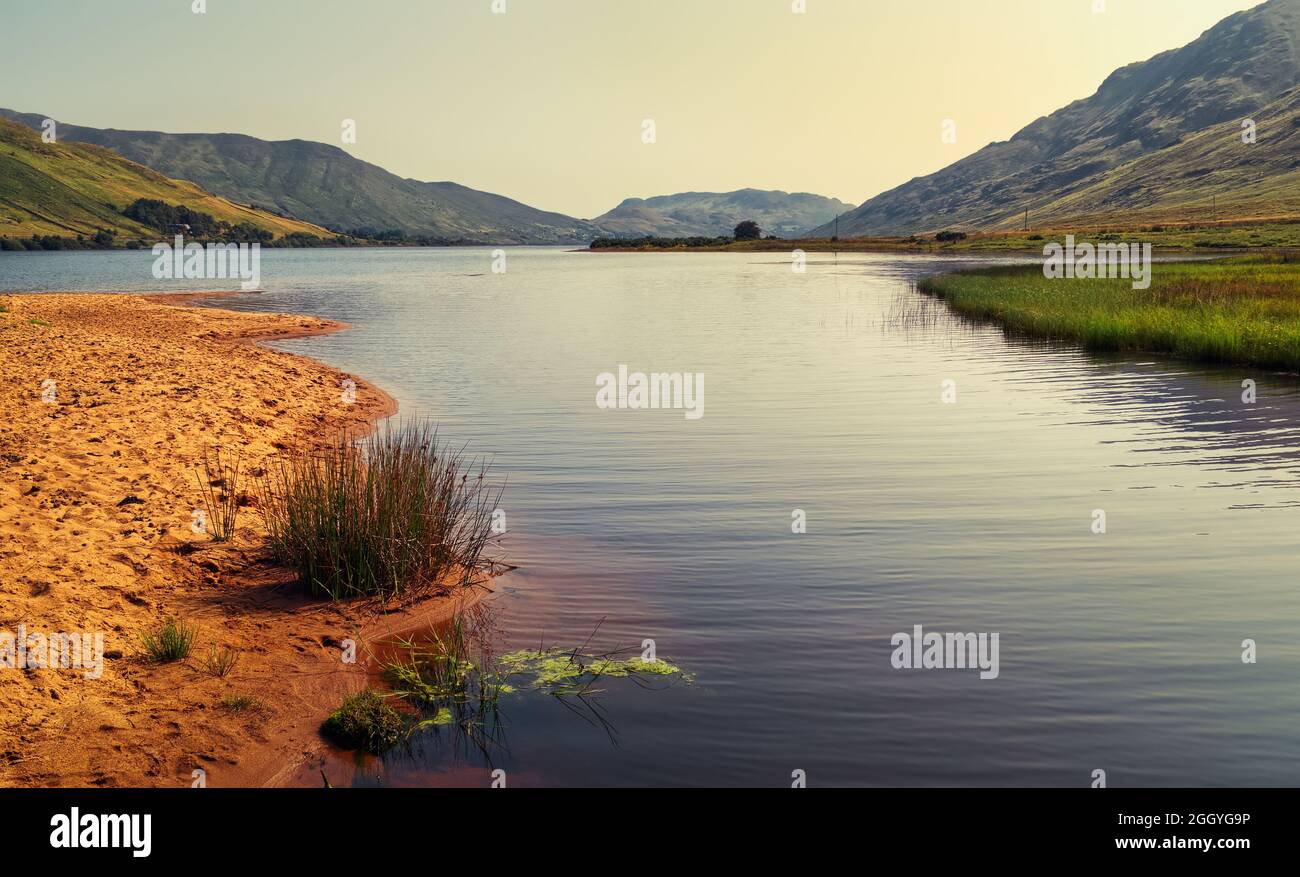 Beautiful landscape scenery of sandy beach and green hills in the ...