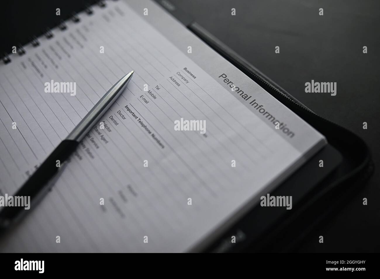 Filling out a form with personal information. Documents in a folder on ...