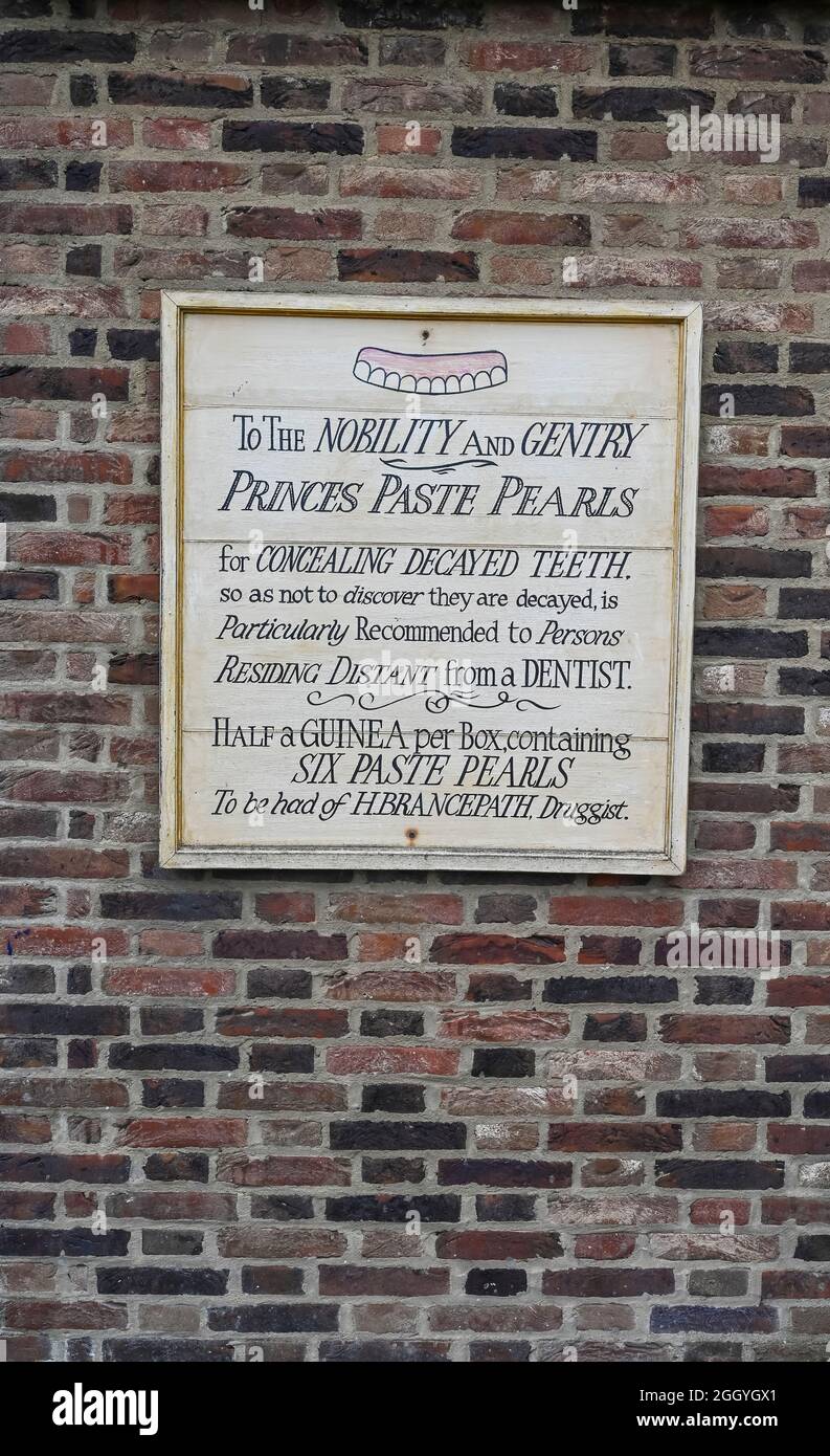 This is one of several quayside advertisement signs at the Victorian ...