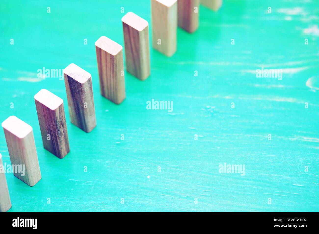 Stick wood block standing on stacked square wood blocks, abstract ...