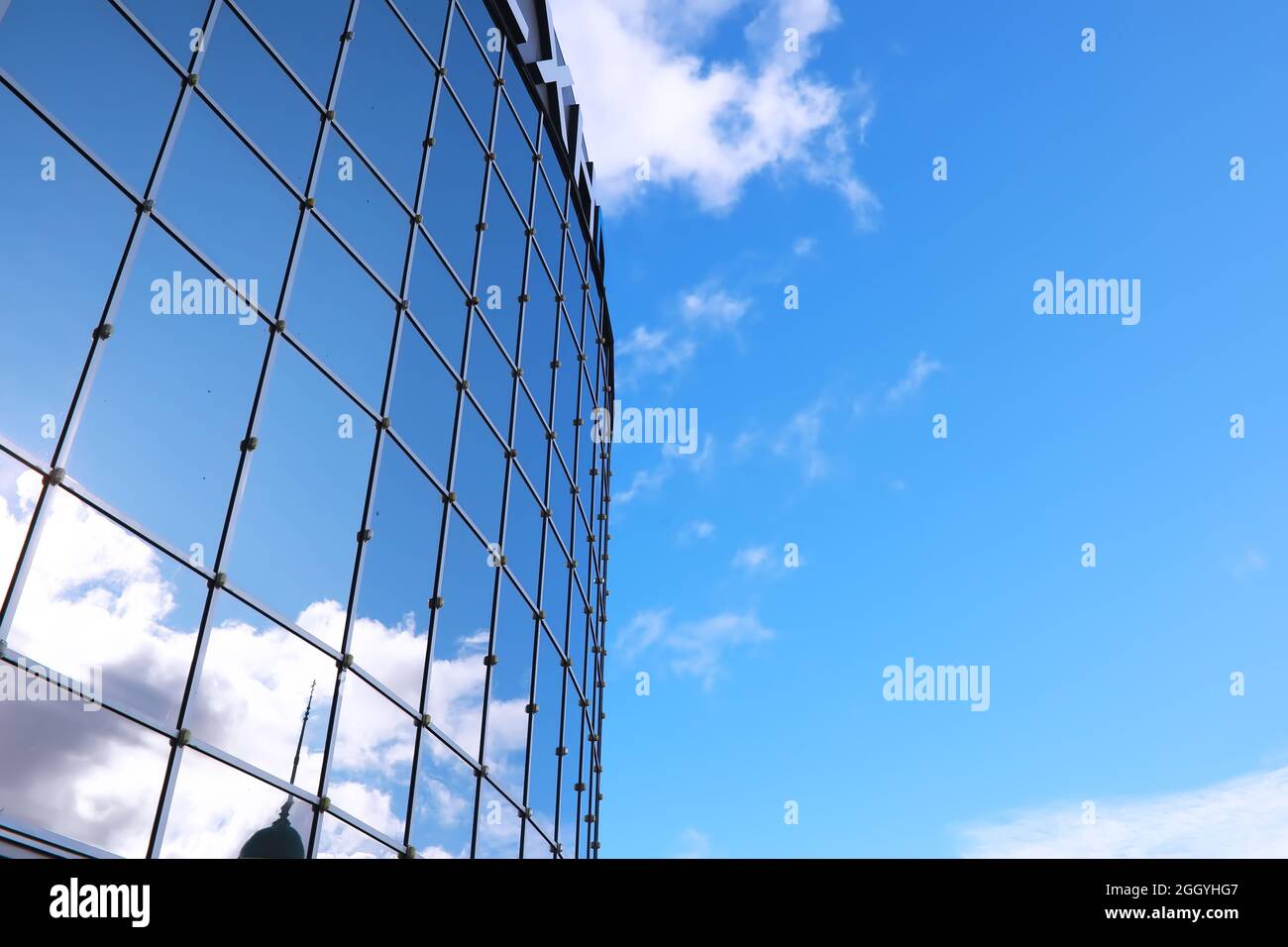 Architectural detail of the facade with multiple reflections of other ...