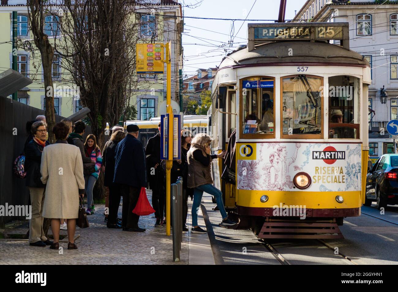 Busy people entering to tram after work Stock Photo - Alamy