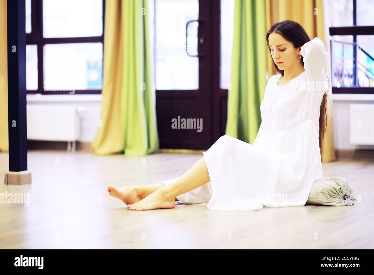 Relaxed serene pretty young woman at home, happy calm lady dream enjoy ...