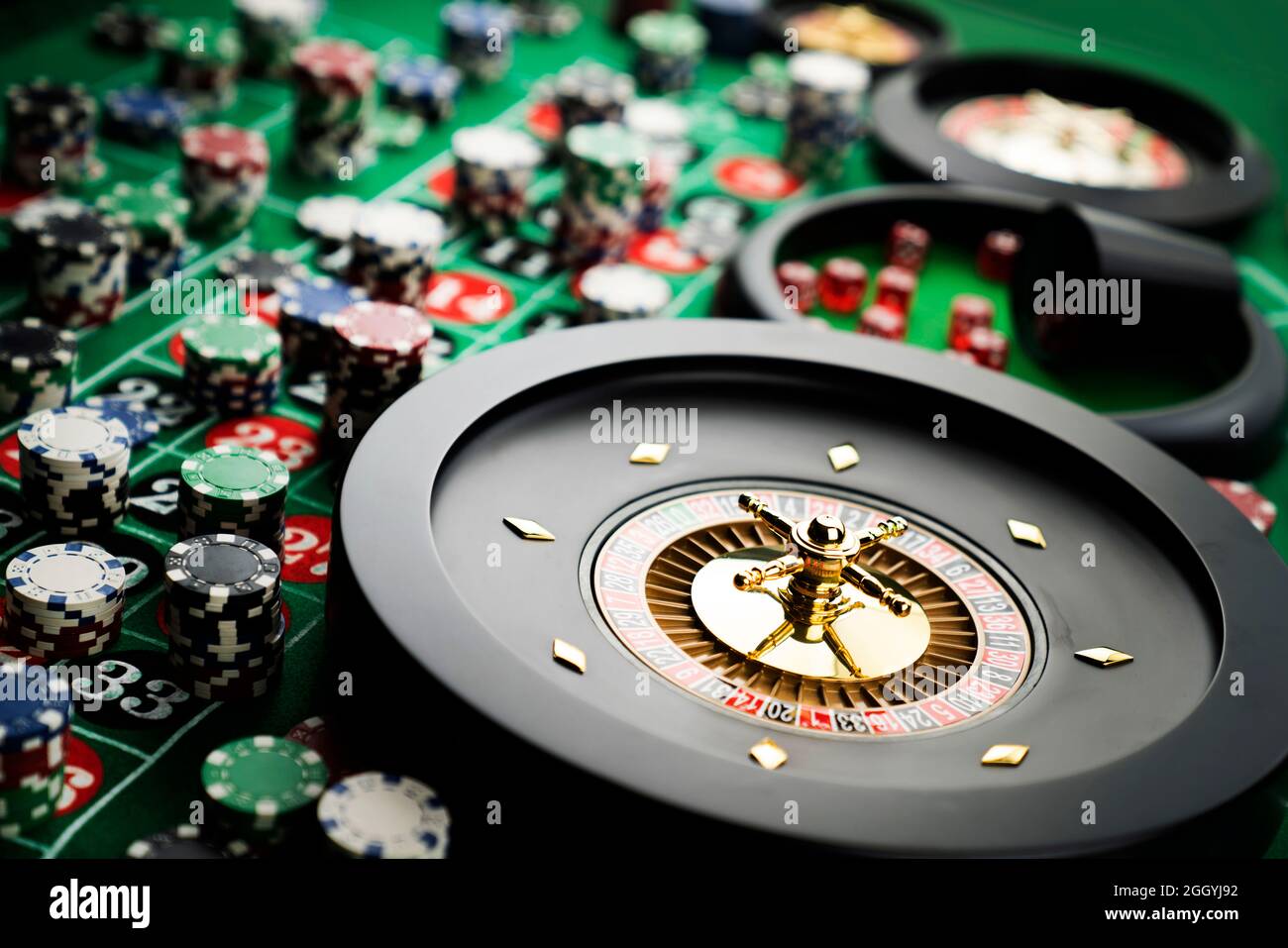 Roulette table in casino. Roulette wheel. Casino felt green table with ...