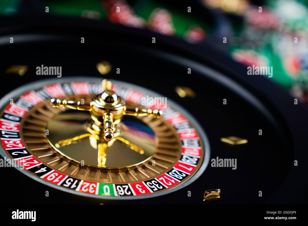 Roulette table in casino. Roulette wheel. Casino felt green table with ...