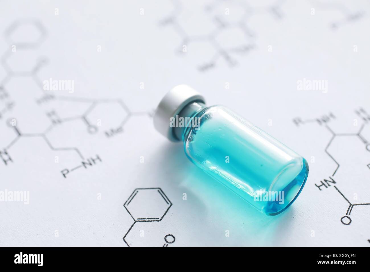 small jars with injection and syringe for injection on blue background ...