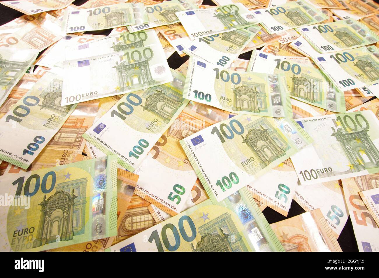 Many euro banknotes spread all over. Wealth and economy concept Stock ...
