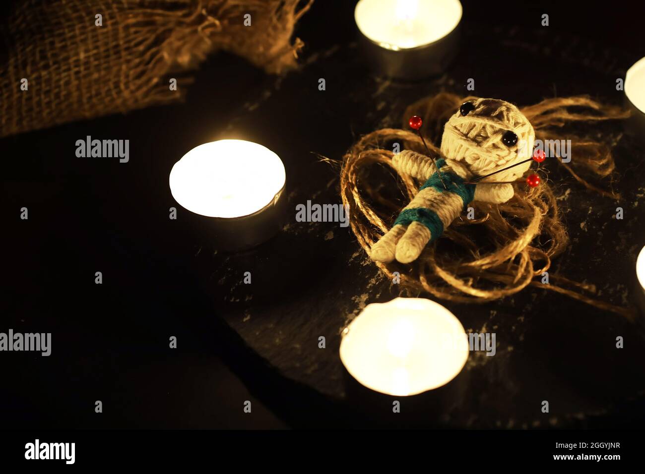 Mystic still life with voodoo doll, the tarot cards, books, evil ...