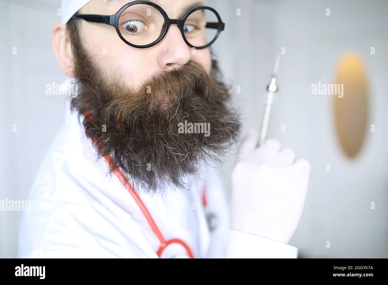 Doctor crazy. Mad beard scientist conducts experiments in a scientific ...