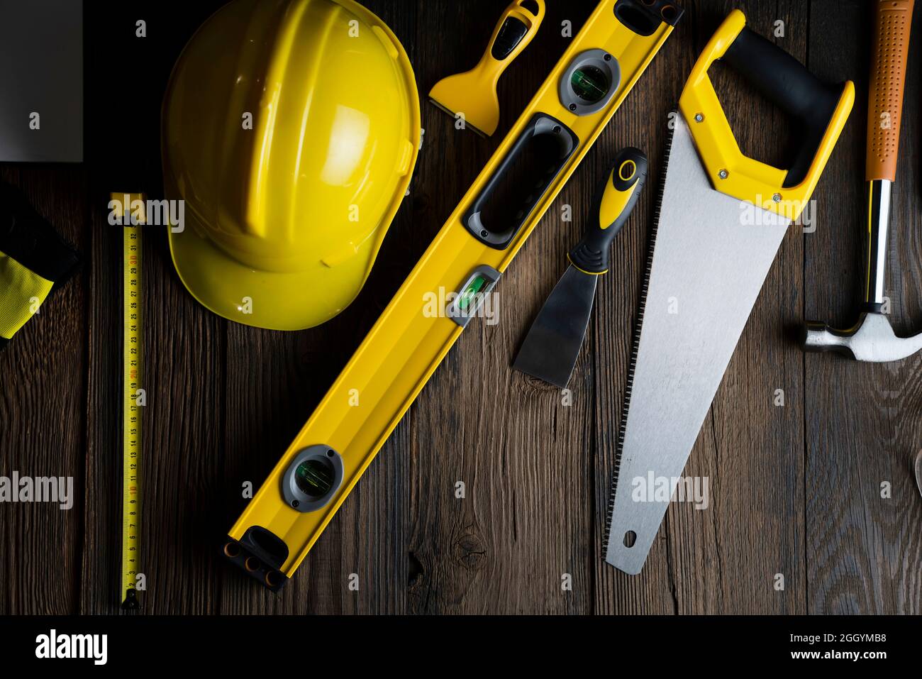Contractor theme. Tool kit of the contractor: yellow hardhat, libella ...