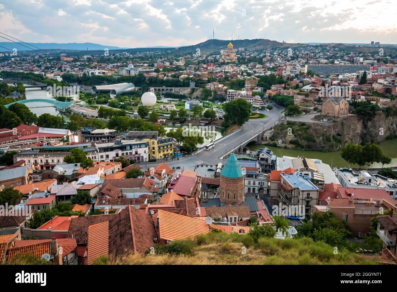 Aerial scenic panoramic view of Tbilisi city center at summer sunrise ...