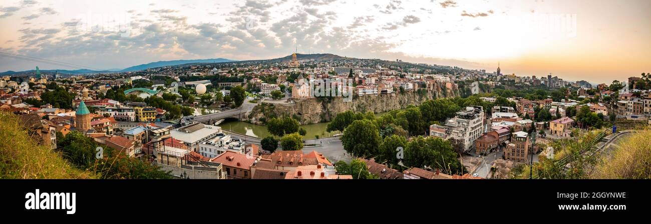 Aerial scenic panoramic view of Tbilisi city center at summer sunrise ...