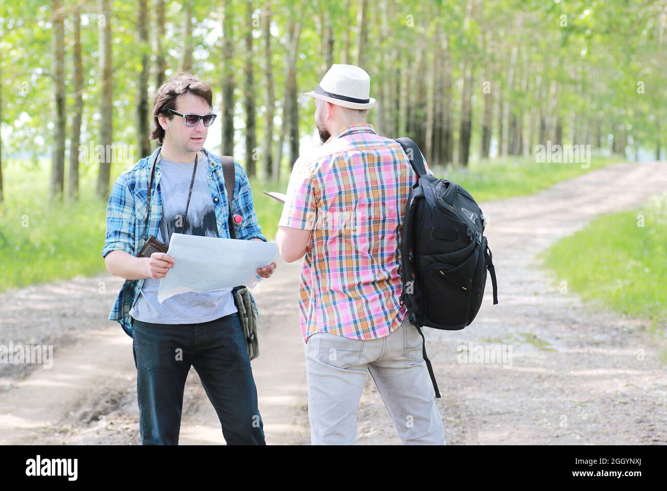 A young man looks at a map in the nature so as not to get lost Stock ...