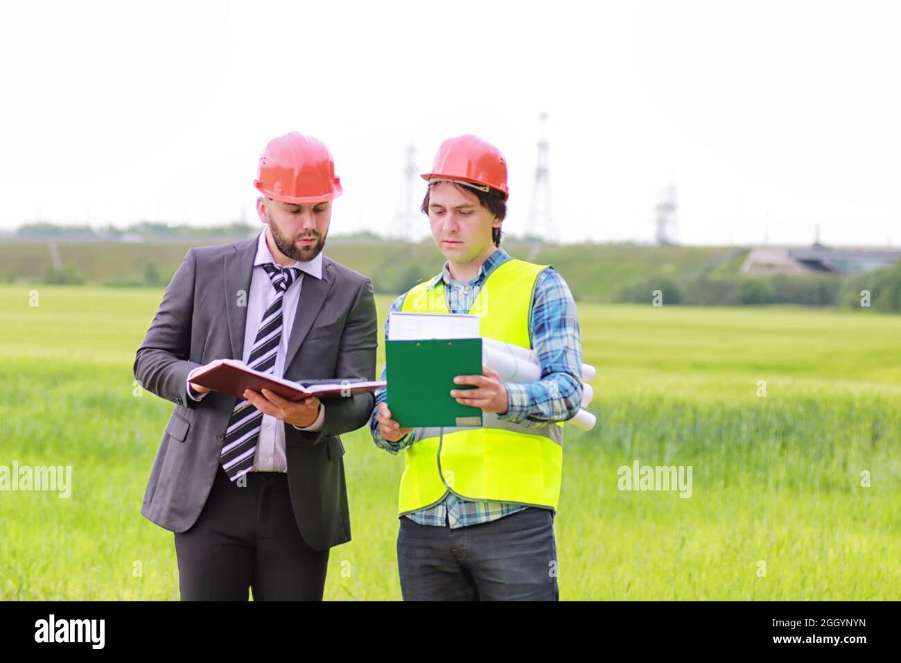 construction two man in the field Stock Photo - Alamy