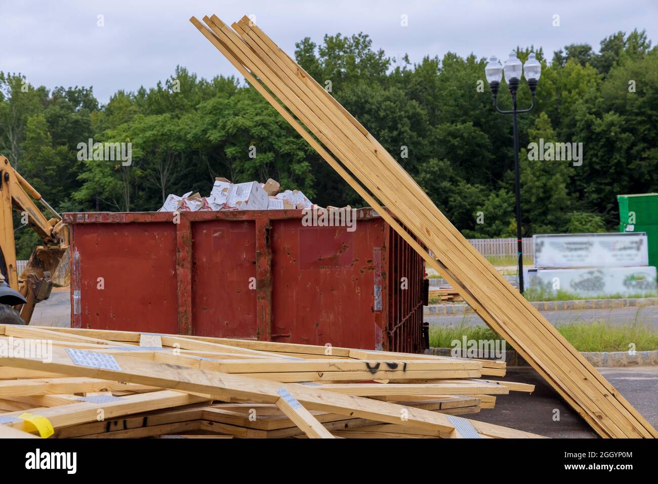 Construction trash dumpsters in an metal container, stacker wooden ...