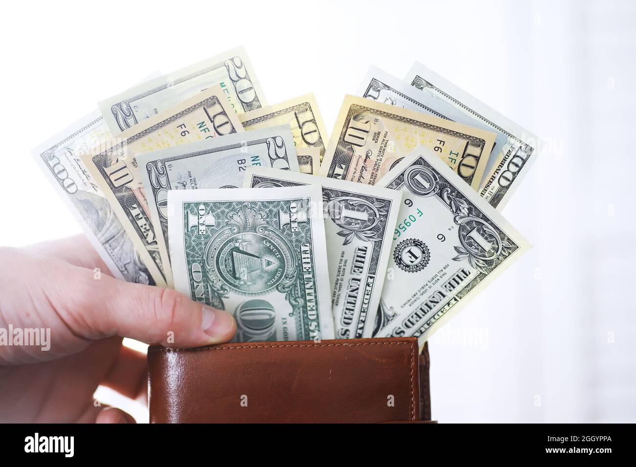 Cash money in a large pile as a finance background. Paper money close ...