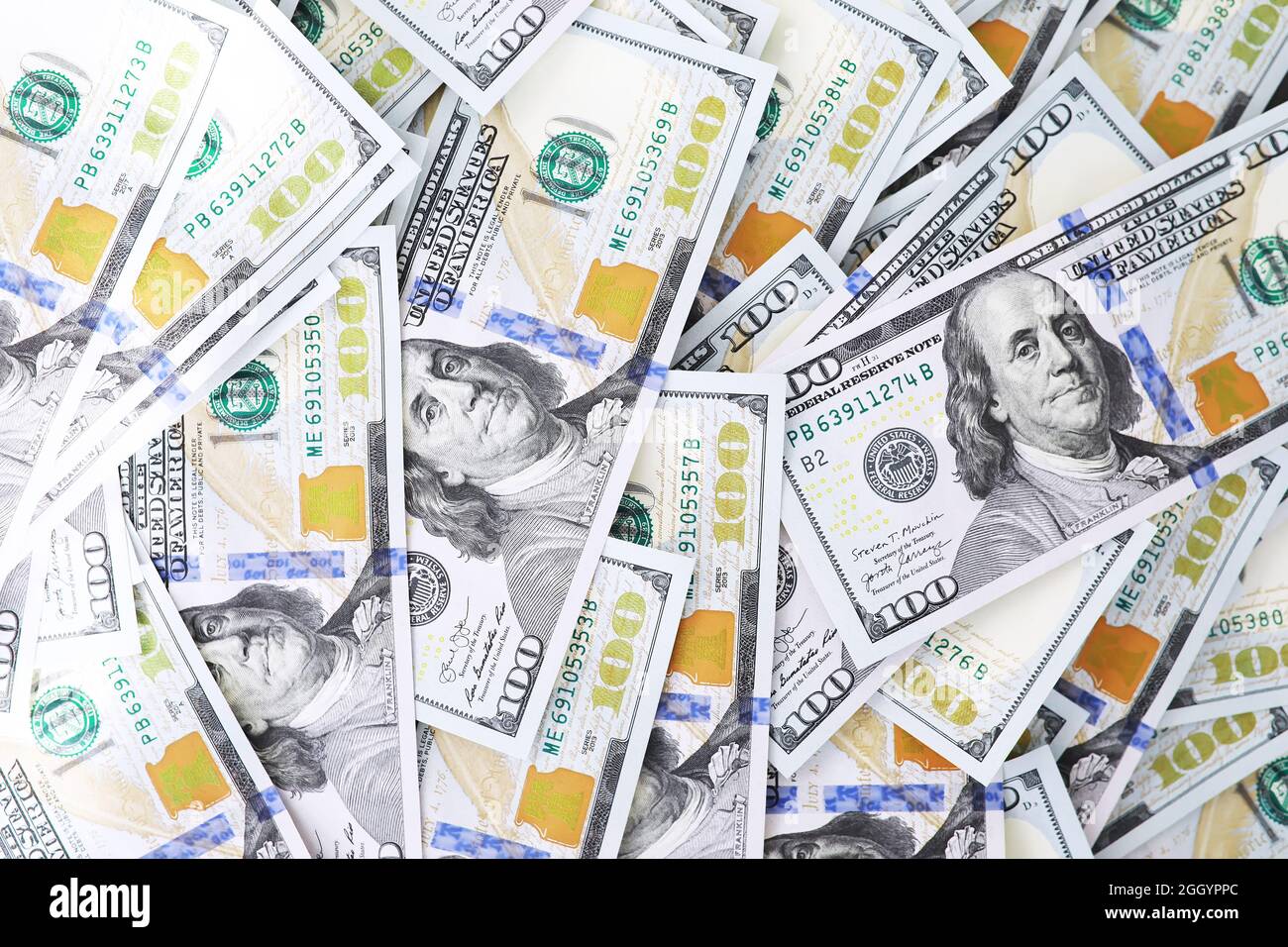 Cash money in a large pile as a finance background. Paper money close ...