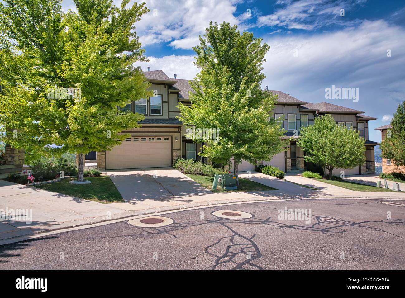 Complex residential houses with garage and trees at the front Stock ...
