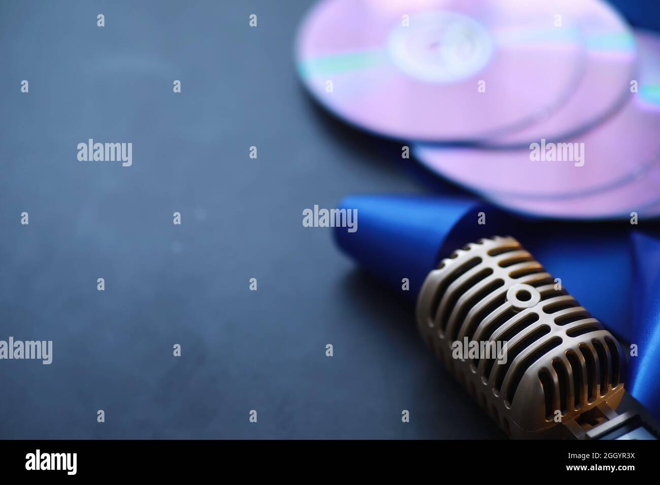 The concept of media presentations. Retro microphone on background ...
