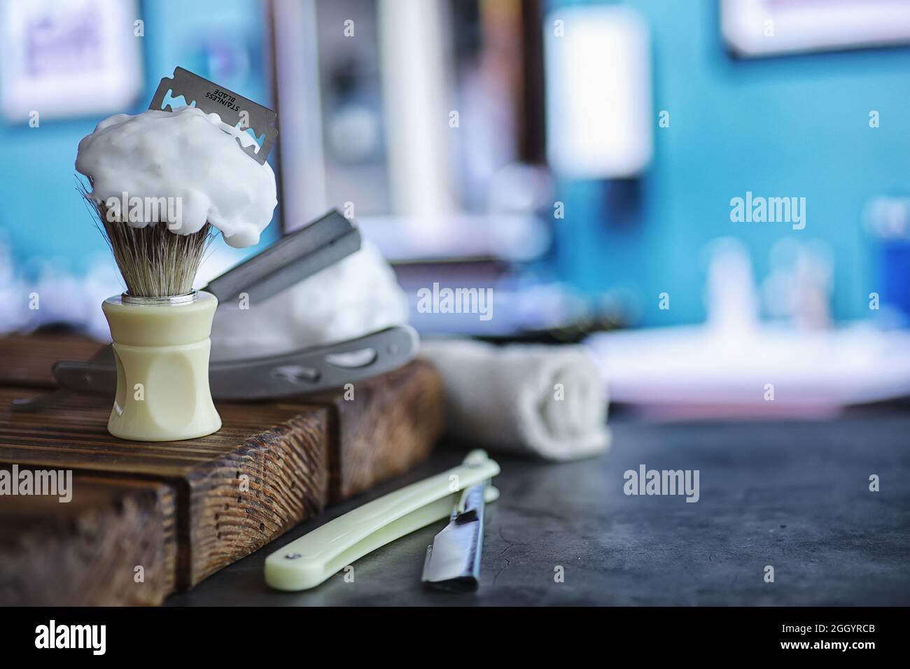 Shaving accessories on a wooden texture background. Tools. Disposable ...