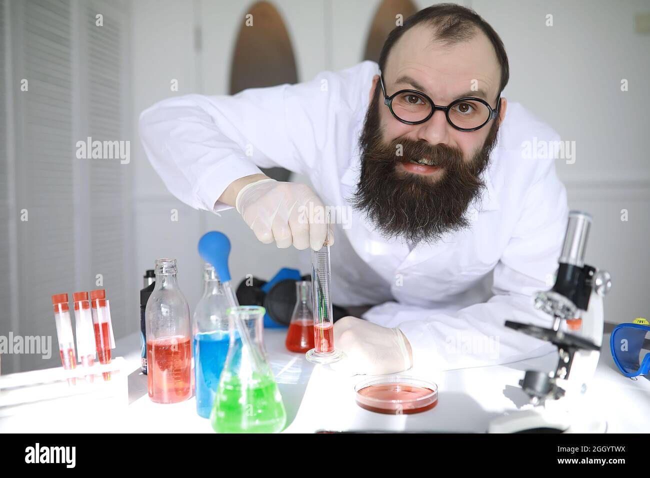 Chemist crazy. A mad scientist conducts experiments in scientific ...