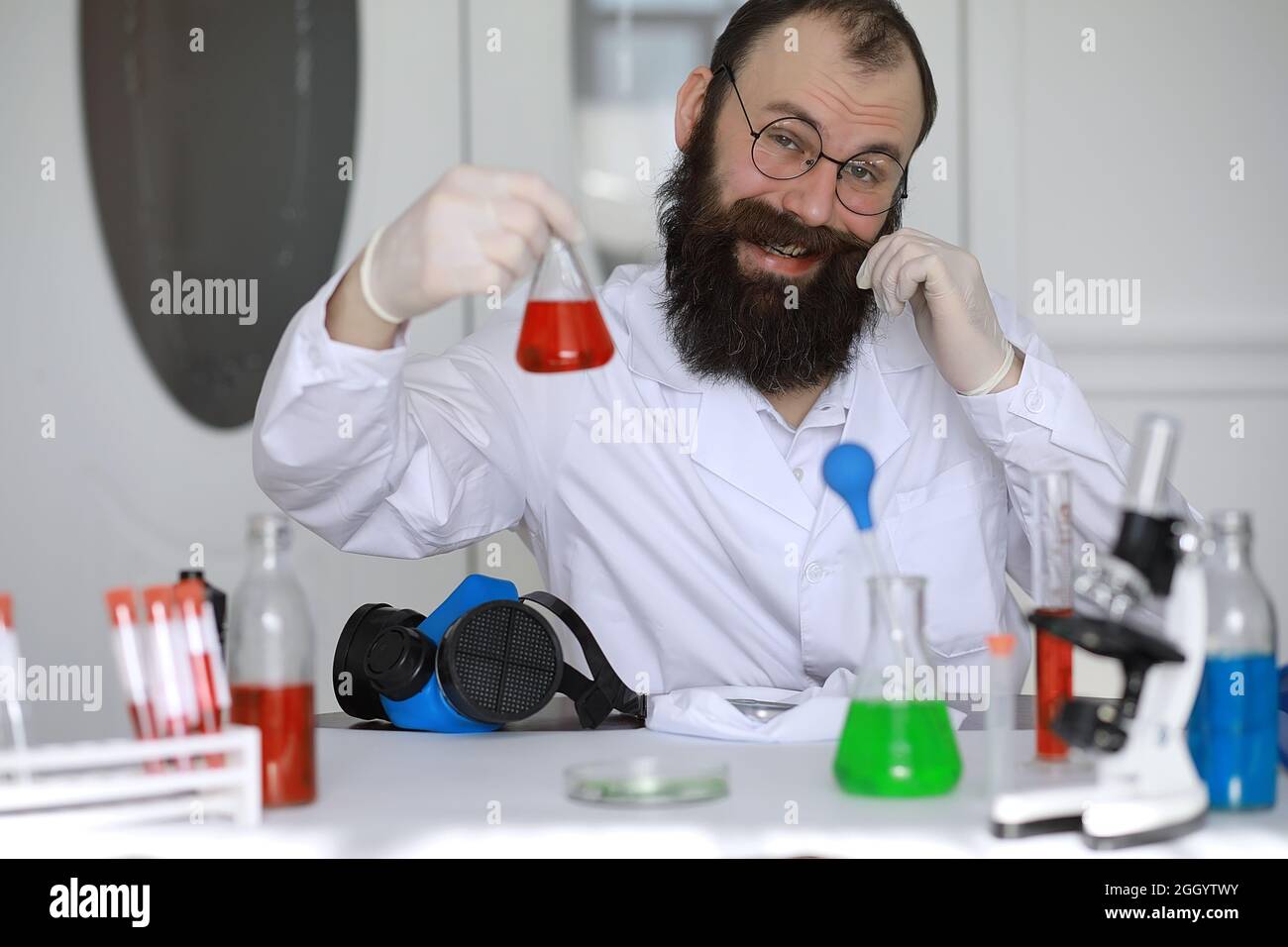 Chemist crazy. A mad scientist conducts experiments in scientific ...