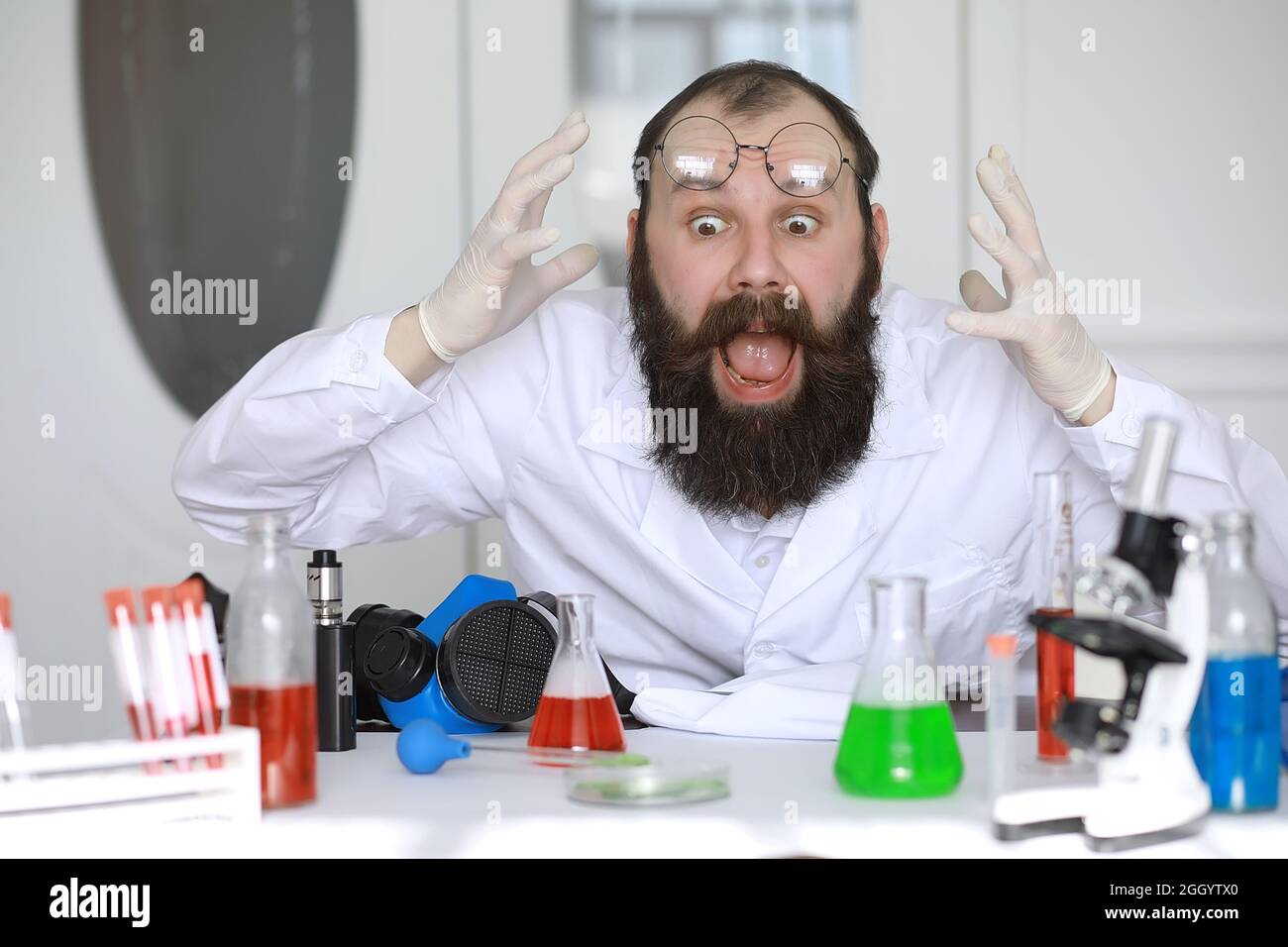 Chemist crazy. A mad scientist conducts experiments in scientific ...