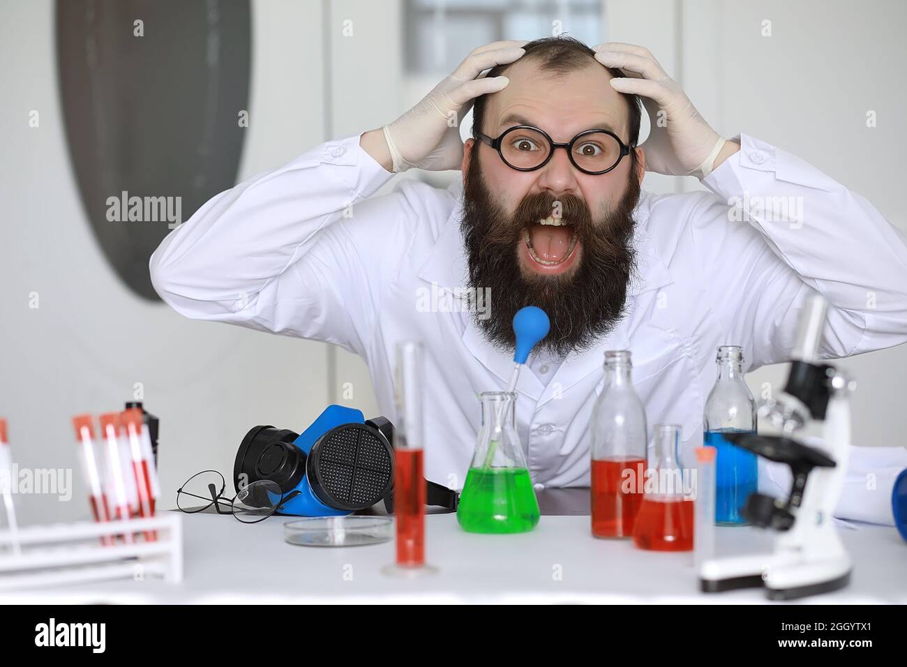Chemist crazy. A mad scientist conducts experiments in scientific ...
