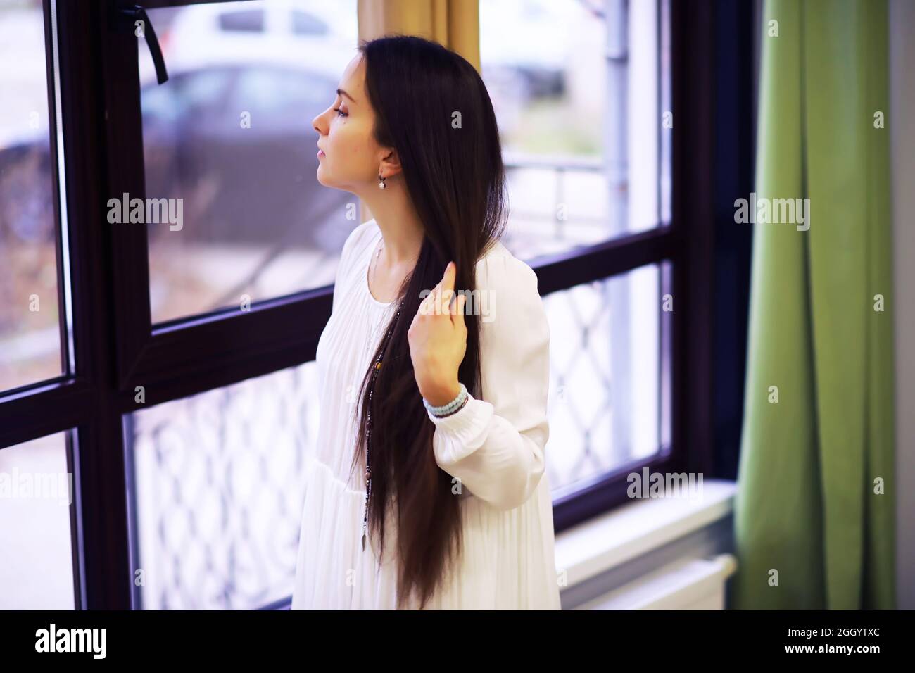 Relaxed serene pretty young woman at home, happy calm lady dream enjoy ...