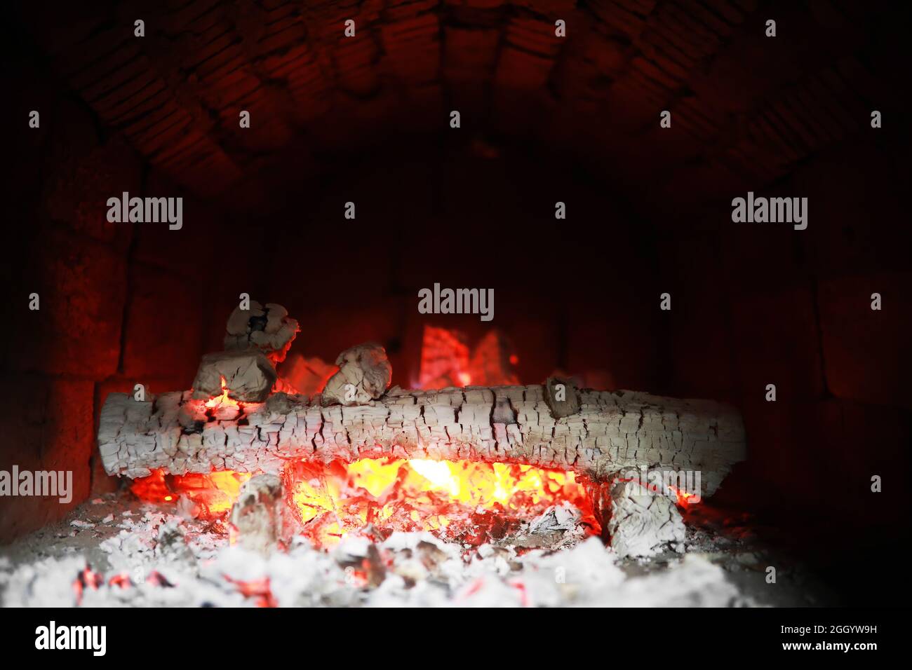 Burning red hot sparks fly from big fire. Burning coals, flaming ...