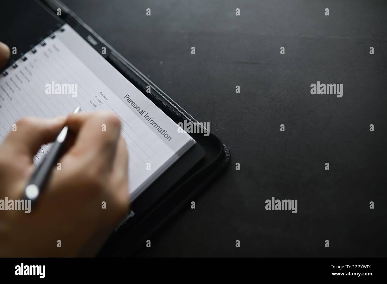 Filling out a form with personal information. Documents in a folder on ...