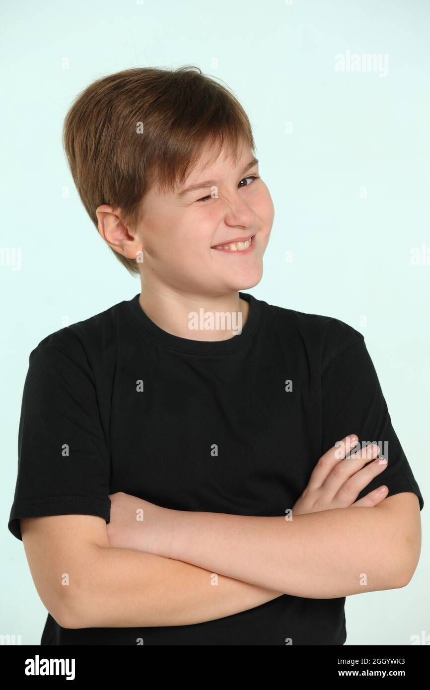 In the portrait, a smart and talented child prodigy winks cheerfully ...