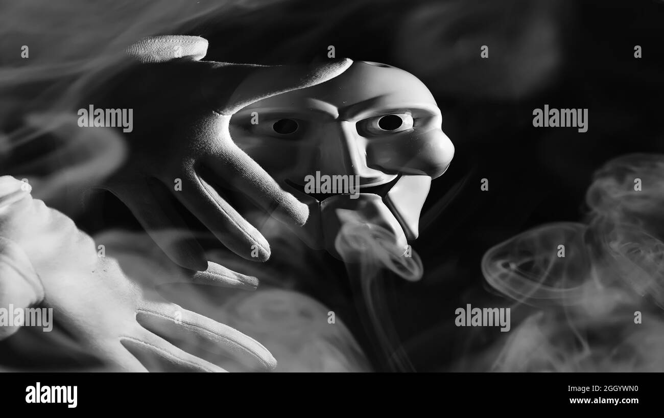White scary mask on a black background with whites hands Stock Photo ...