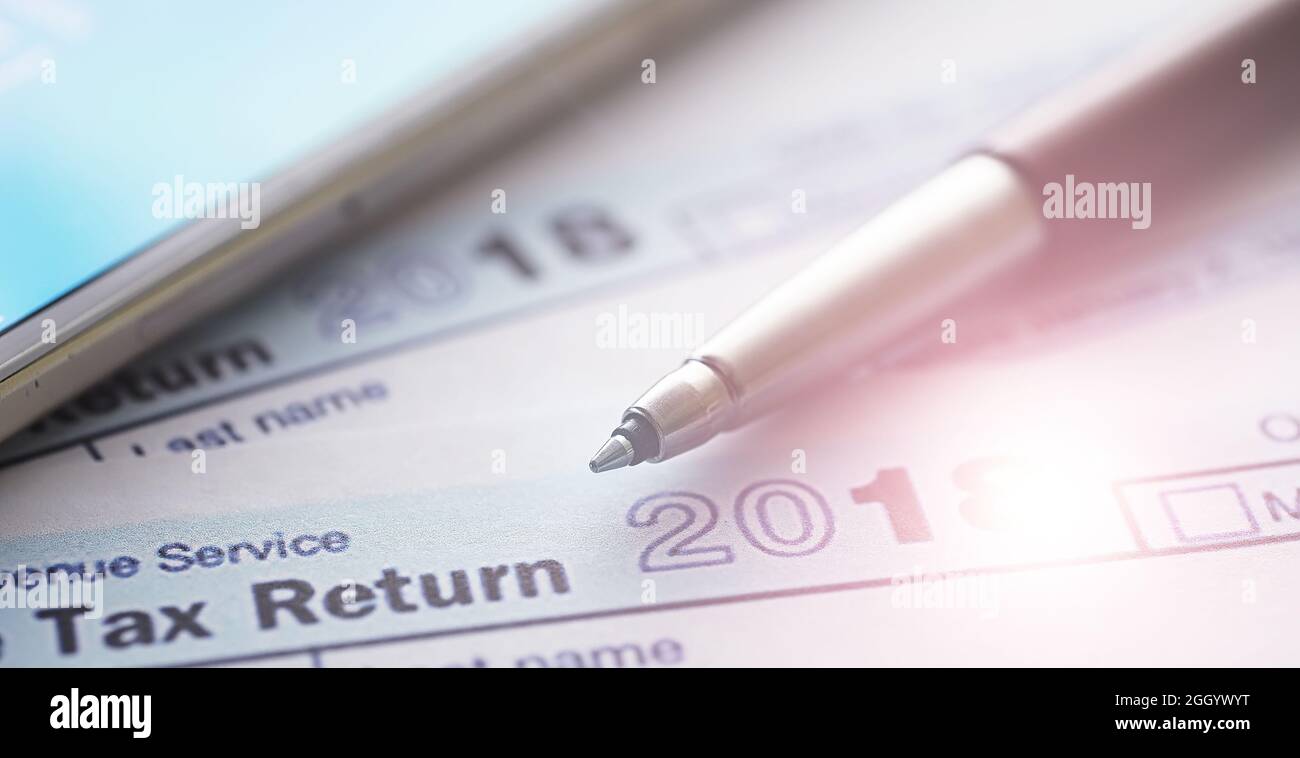 Annual tax reporting. Tax form on the table. Financial statements ...