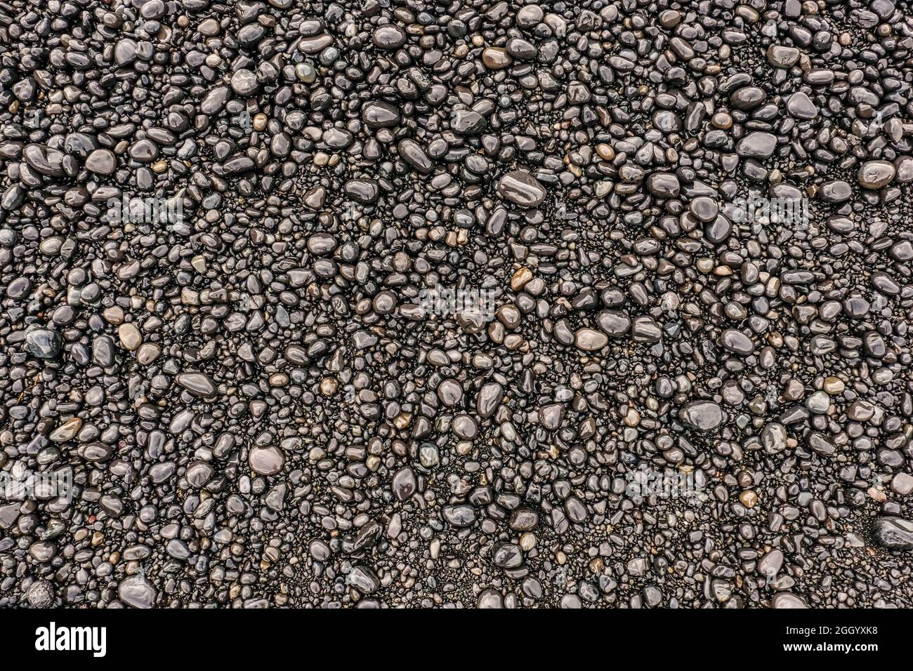 Black volcanic pebbles hi-res stock photography and images - Alamy