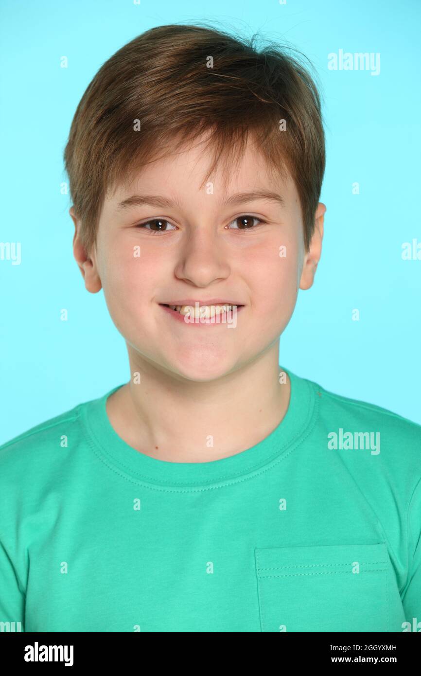The portrait shows a close-up of the face of a handsome cheerful young ...