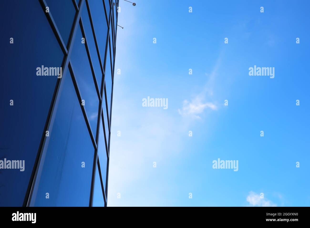Architectural detail of the facade with multiple reflections of other ...