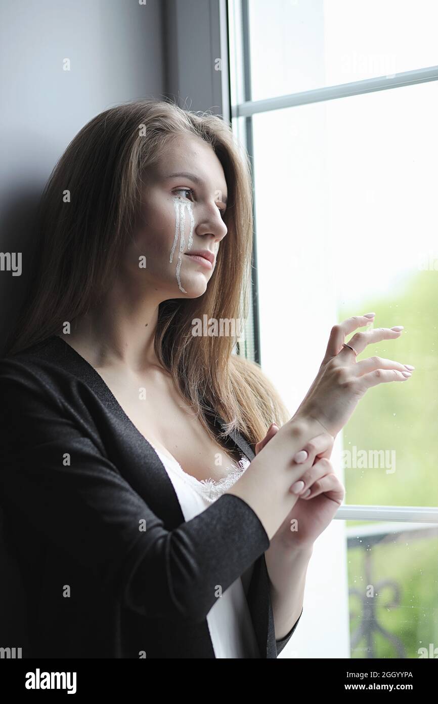 Beautiful girl with tears in eyes. Young girl with painted tears posing ...