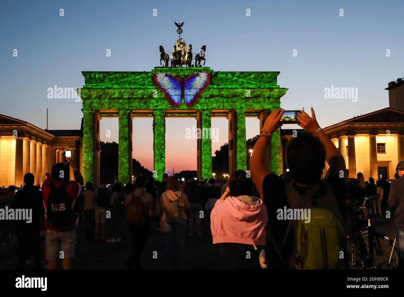 Berlin, Germany. 3rd Sep, 2021. Visitors take photos of the illuminated ...