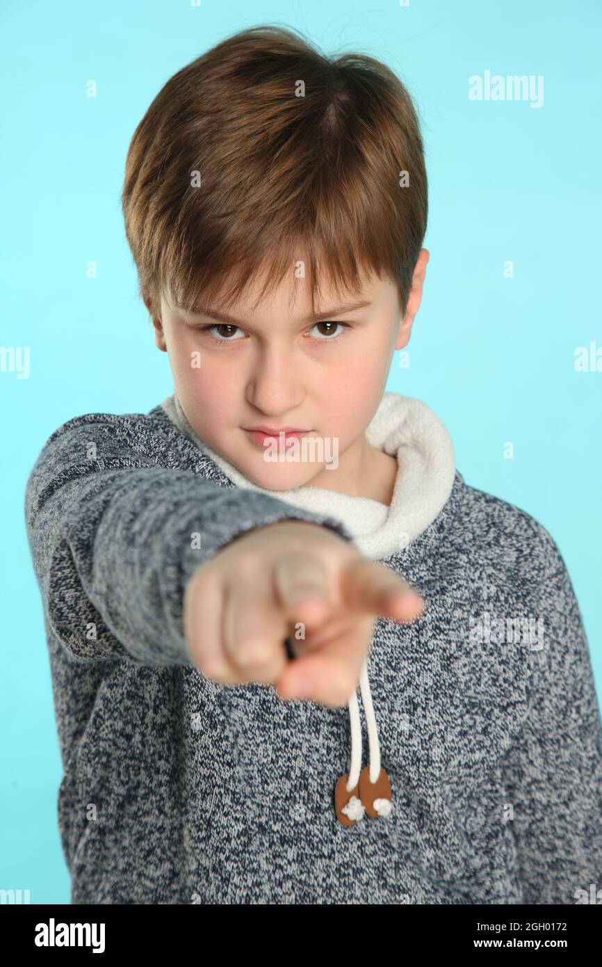 Close-up portrait: handsome, intelligent teenage boy looks seriously ...