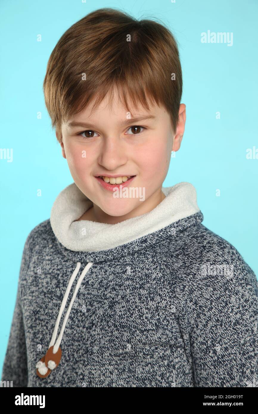 Close-up portrait: handsome, talented teenage boy smiles a little ...