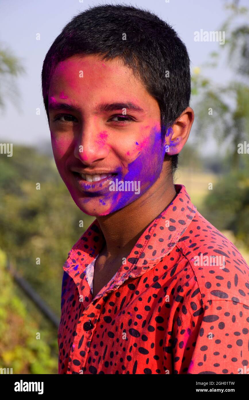 Boy playing with colors, In a happy mood. Concept for Indian festival ...