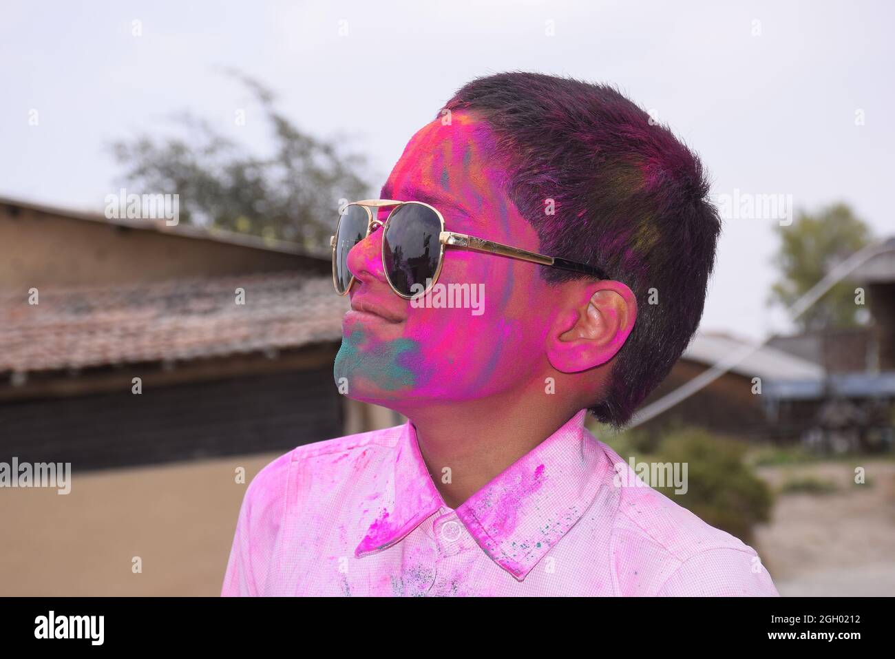 Boy playing with colors, In a happy mood. Concept for Indian festival ...