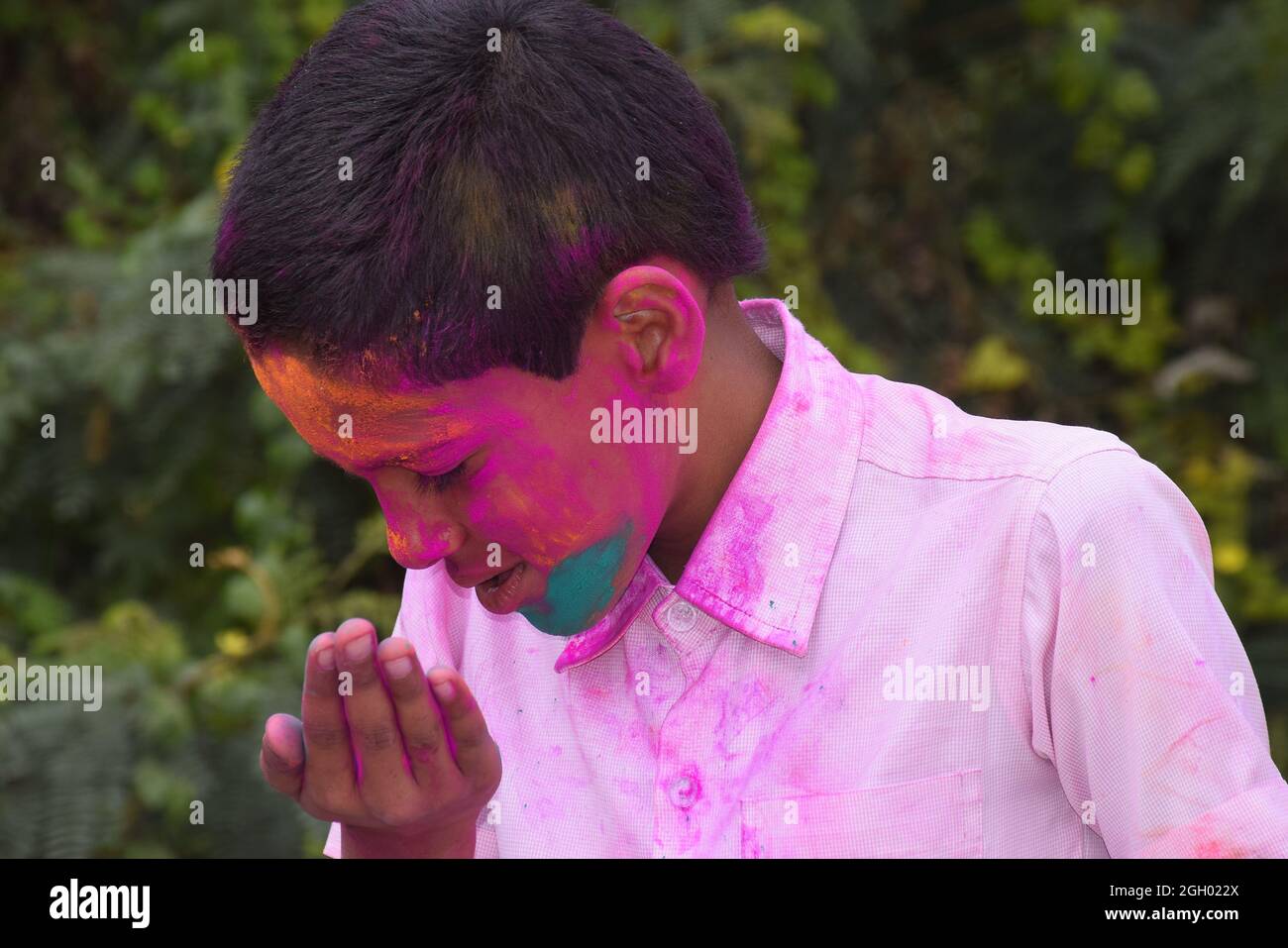Boy playing with colors, In a happy mood. Concept for Indian festival ...