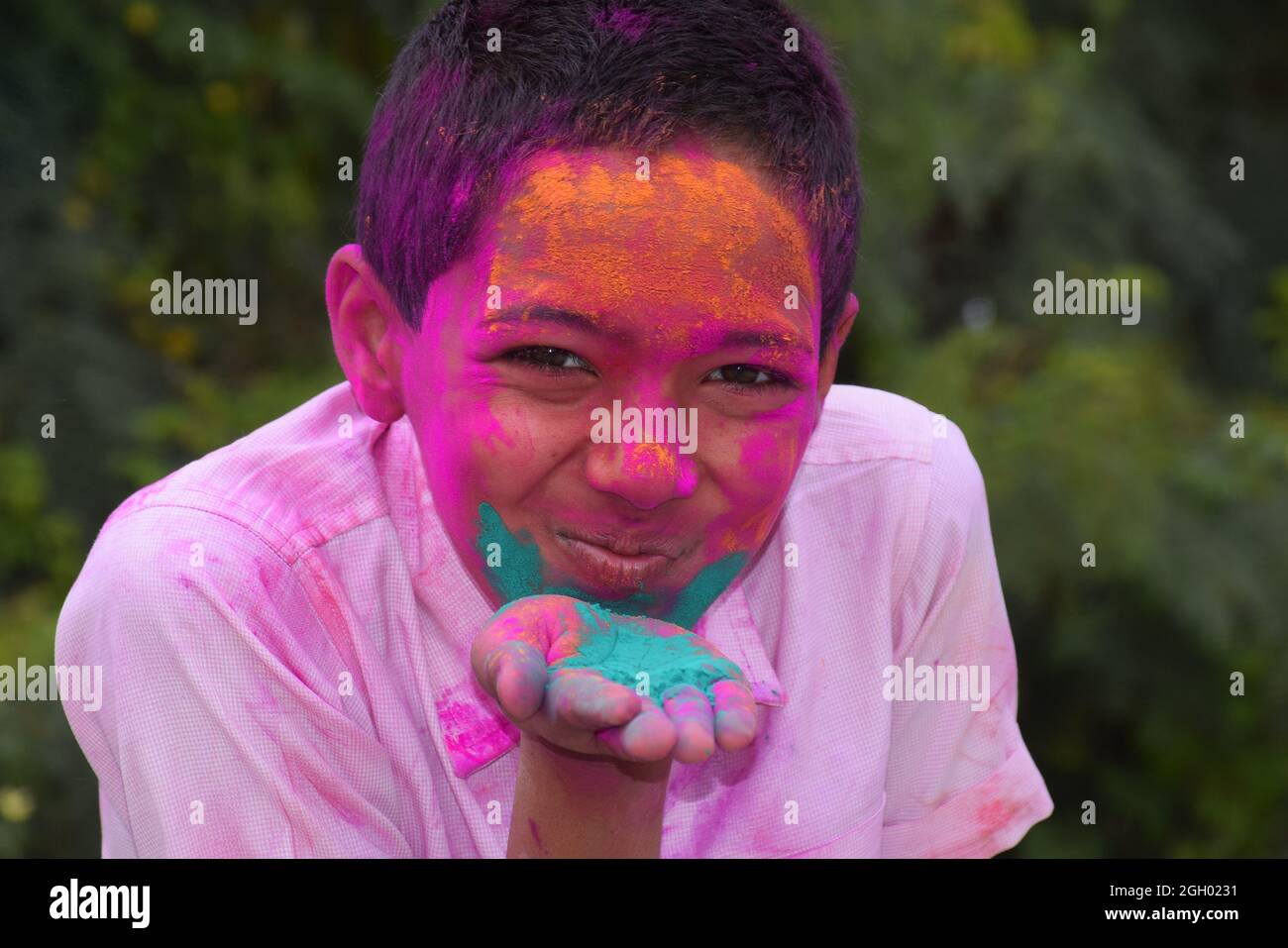 Boy playing with colors, In a happy mood. Concept for Indian festival ...