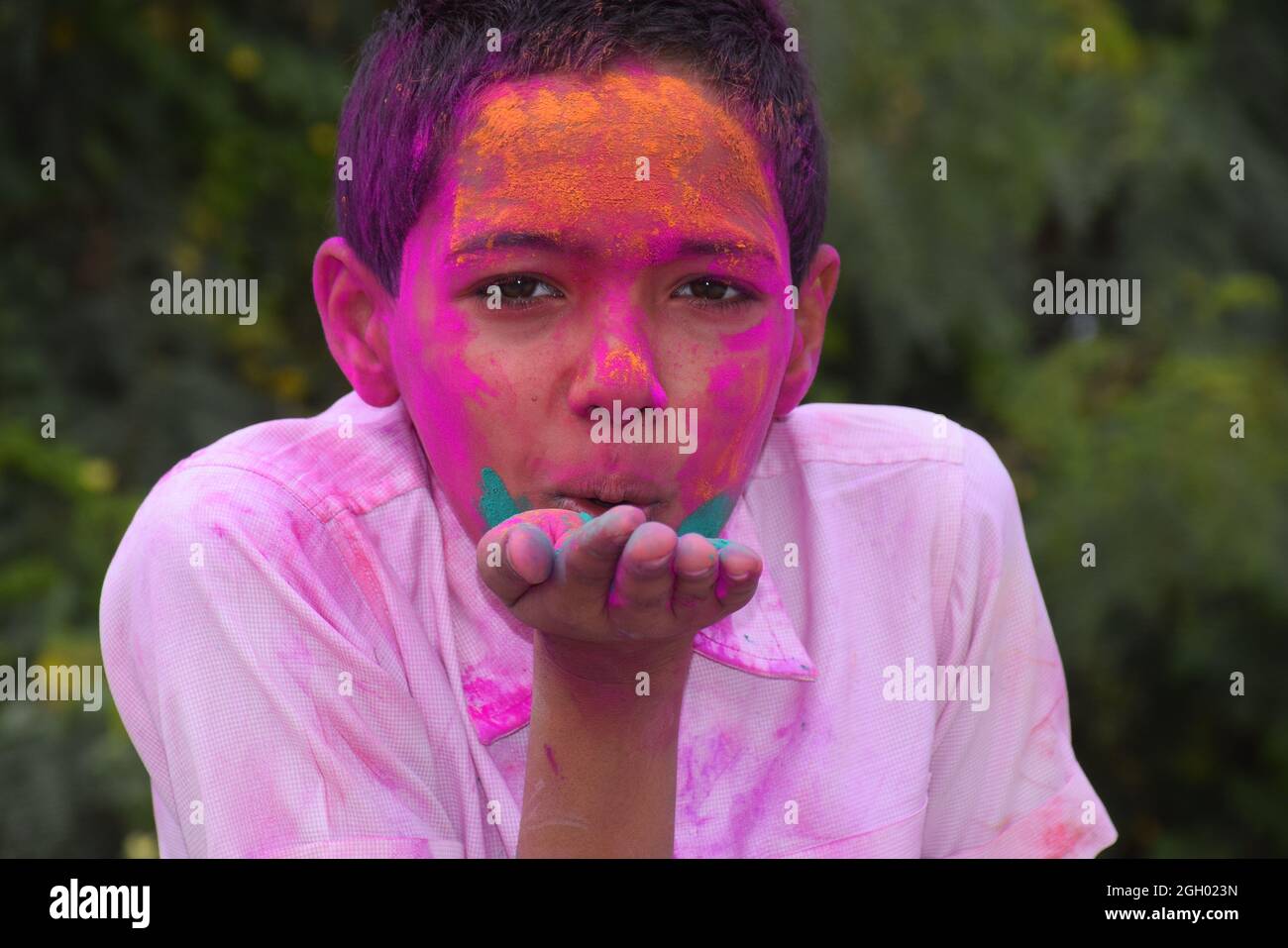 Boy playing with colors, In a happy mood. Concept for Indian festival ...